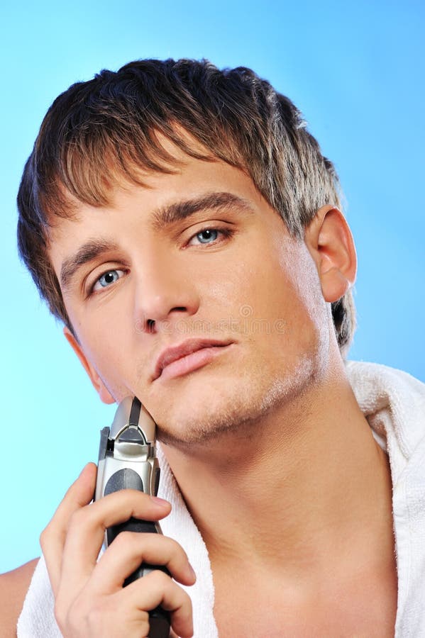Handsome young man shaving stock image. Image of clean - 13173771