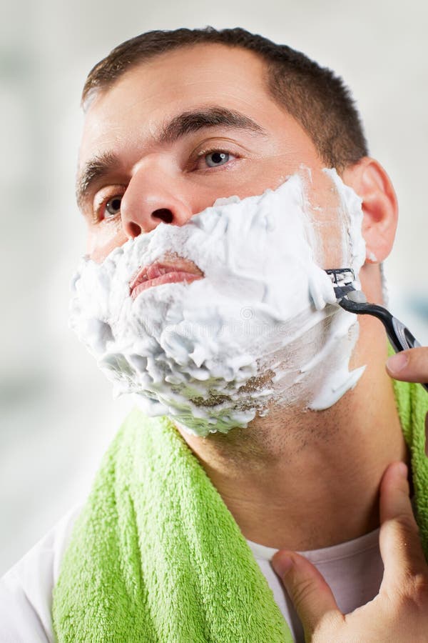 Handsome Young Man is Shaving His Face Stock Photo - Image of portrait ...