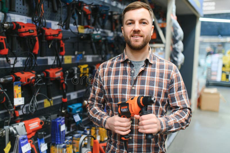 Handsome Young Man Shopping for Tools at Hardware Store Stock Photo ...