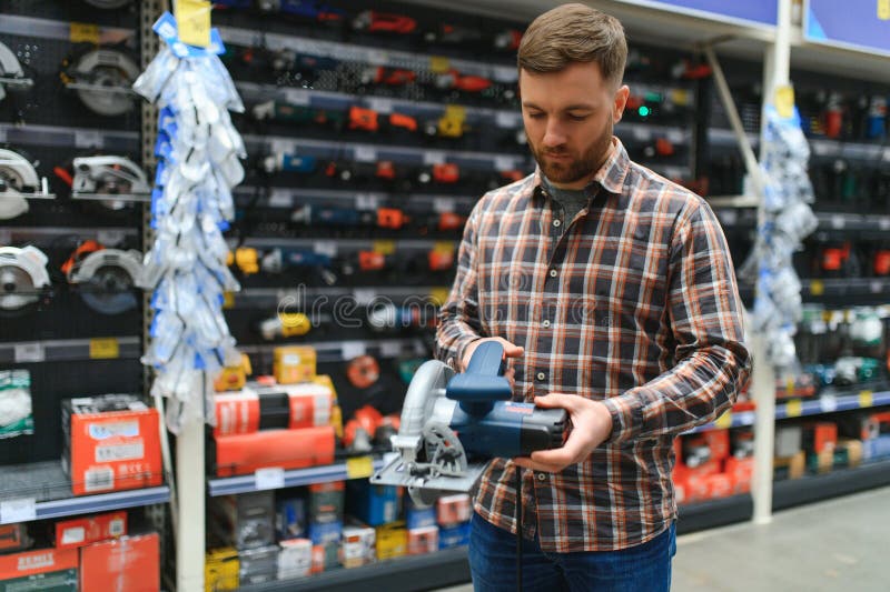 Handsome Young Man Shopping for Tools at Hardware Store Stock Image ...