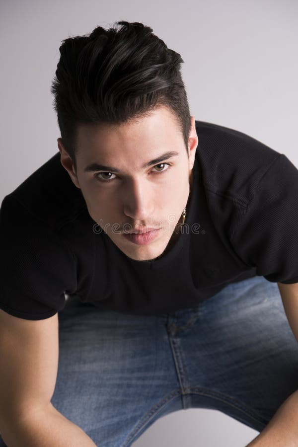 Handsome Young Man Sitting, Seen from Above Stock Photo - Image of ...