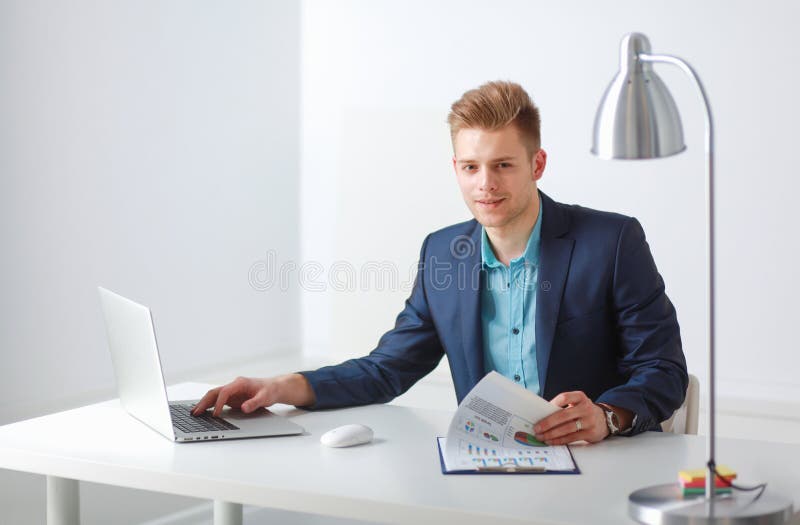 Handsome Young Man Sitting and Working on Laptop Computer Stock Image ...