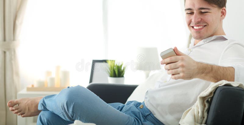 Handsome Young Man Sitting and Working on Laptop Computer Stock Image ...