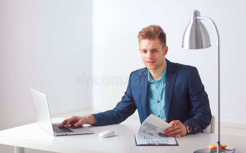 Handsome Young Man Sitting and Working on Laptop Computer Stock Photo ...
