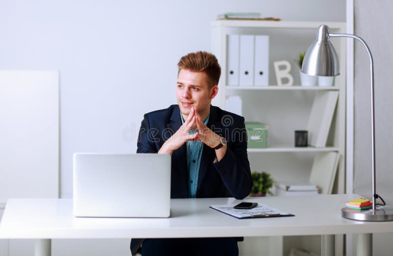 Handsome Young Man Sitting and Working on Laptop Computer Stock Photo ...
