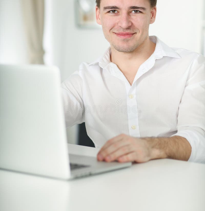 Handsome Young Man Sitting and Working on Laptop Computer Stock Image ...