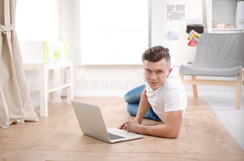 Handsome Young Man Sitting and Working on Laptop Computer Stock Image ...