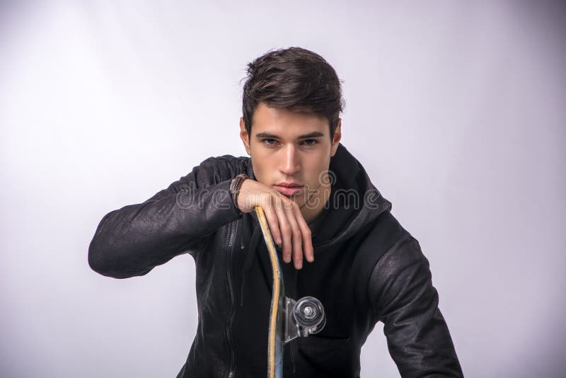 Handsome Young Man with Skateboard Under His Arm Stock Image - Image of ...