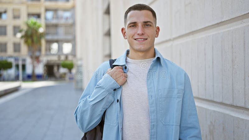 A Handsome Young Man Smiling in an Urban Environment Stock Image ...