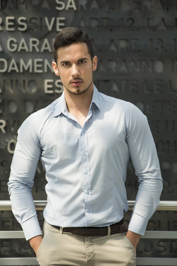 Handsome Young Man Standing in Front of Panel with Words Stock Image ...