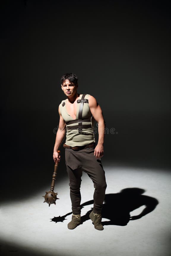 Handsome Young Man Standing with a Mace in Stock Image - Image of ...