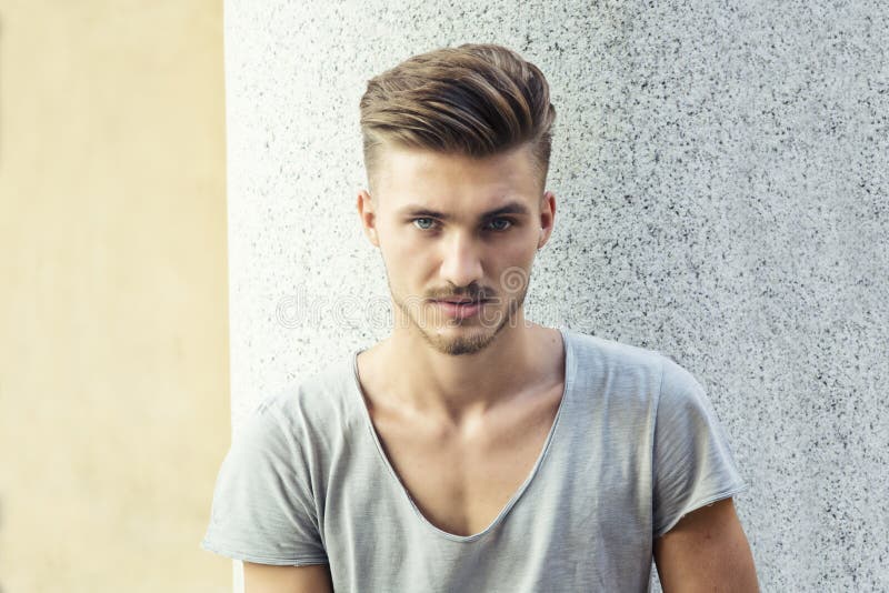 Handsome Young Man Standing Outdoors Against Stock Image - Image of ...