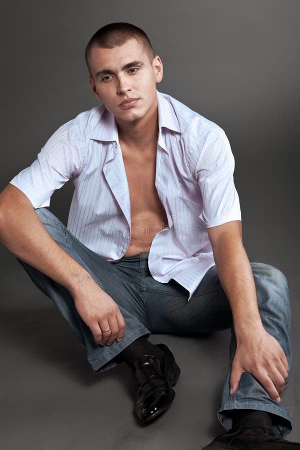 Handsome Young Man in Studio Stock Photo - Image of jeans, handsome ...
