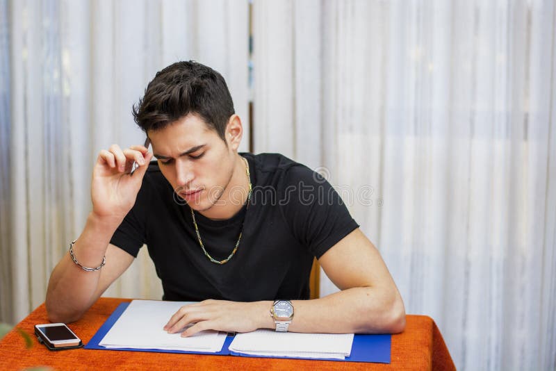 Handsome Young Man Studying or Doing Homework Stock Image - Image of ...