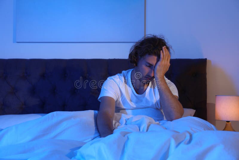 Handsome Young Man Suffering from Insomnia in Dark Room at Night Stock ...