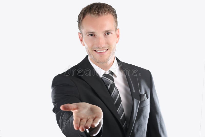 Handsome Young Man in Suit Holding His Hand Out Stock Photo - Image of ...