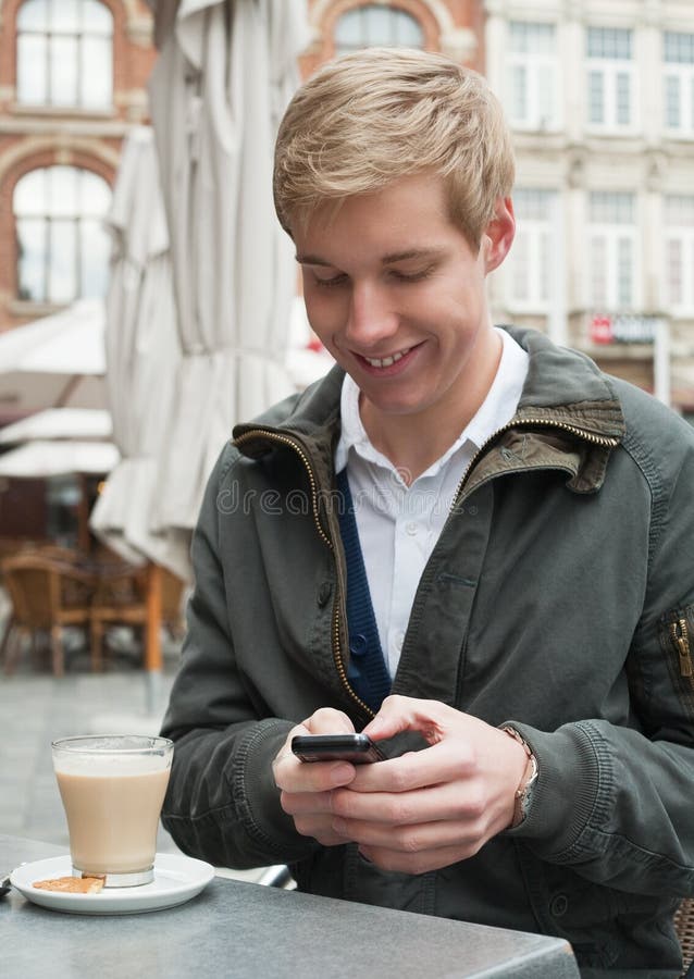 Handsome Young Man Texting a Message Stock Image - Image of reading ...