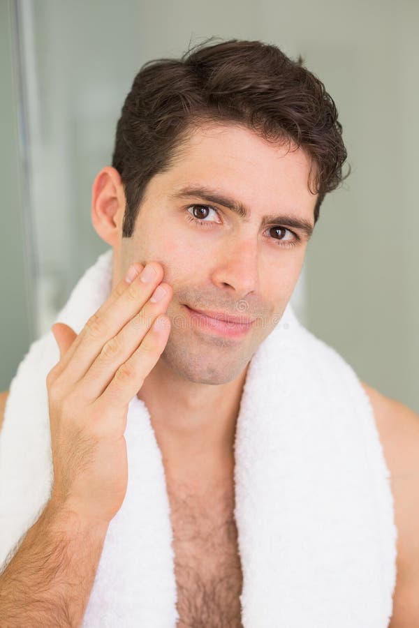 Handsome Young Man Touching His Face Stock Photo - Image of charming ...
