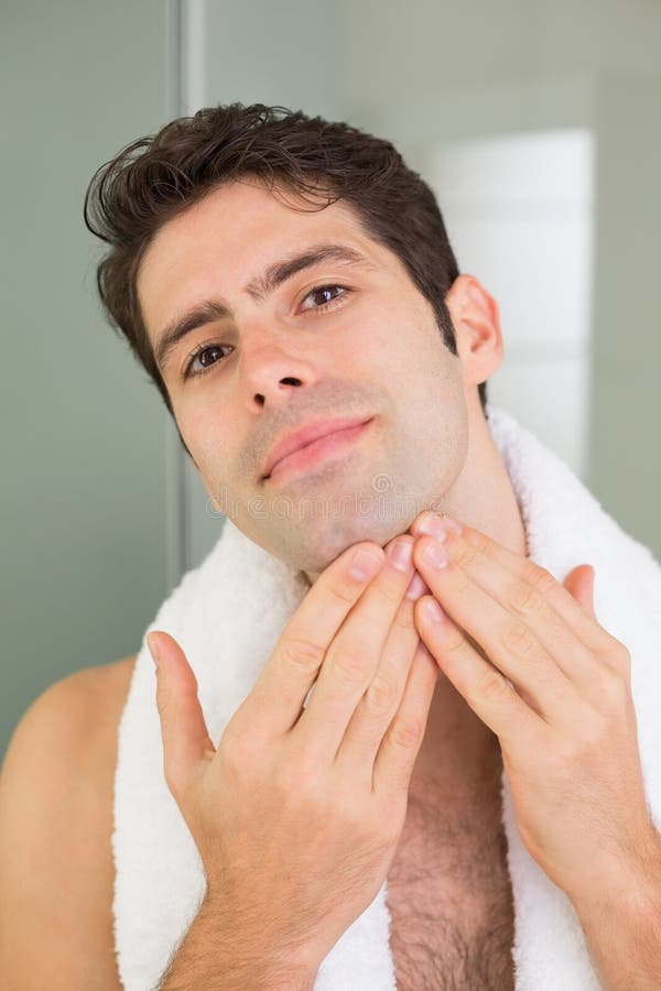 Handsome Young Man Touching His Face Stock Photo - Image of lifestyle ...