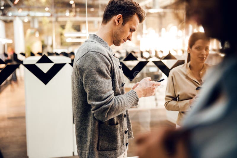 Handsome Young Man Using Cellphone at Work Stock Photo - Image of phone ...