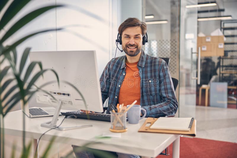 Handsome Young Man Using Computer and Laptop at Work Stock Image ...