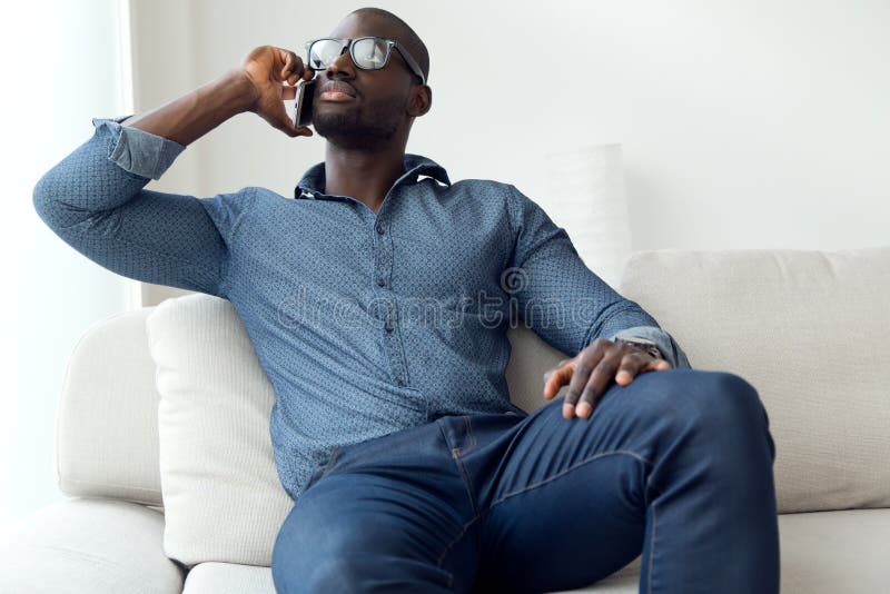 Handsome Young Man Using His Mobile Phone at Home. Stock Image - Image ...
