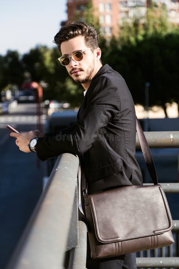 Handsome Young Man Using His Mobile Phone in the Street. Stock Photo ...