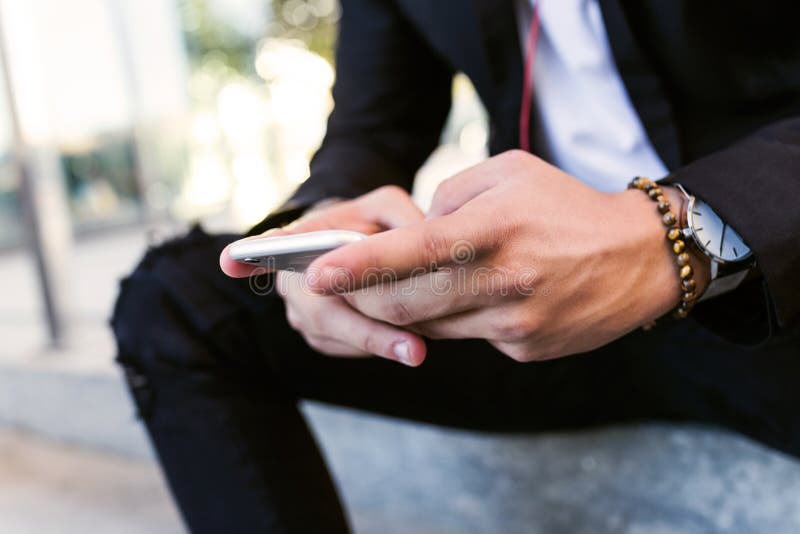 Handsome Young Man Using His Mobile Phone in the Street. Stock Image ...