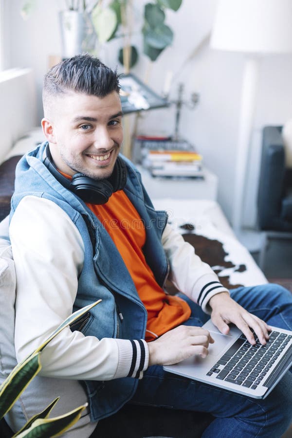 Handsome Young Man Using Laptop Computer with Headset Stock Photo ...