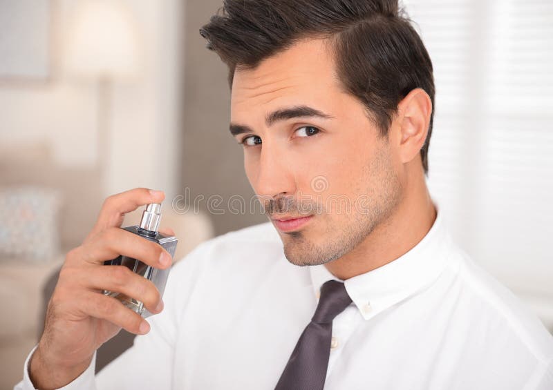 Handsome Young Man Using Luxury Perfume Stock Image - Image of odor ...