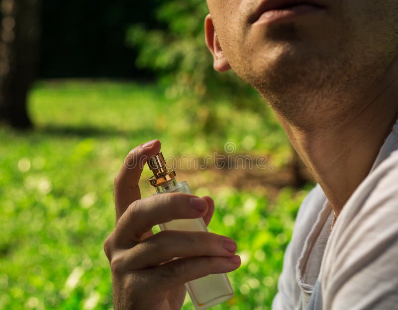 Man using perfume stock photo. Image of hold, beauty - 60642762