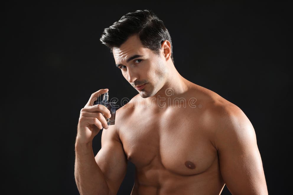 Handsome Young Man Using Perfume Stock Photo - Image of essential ...