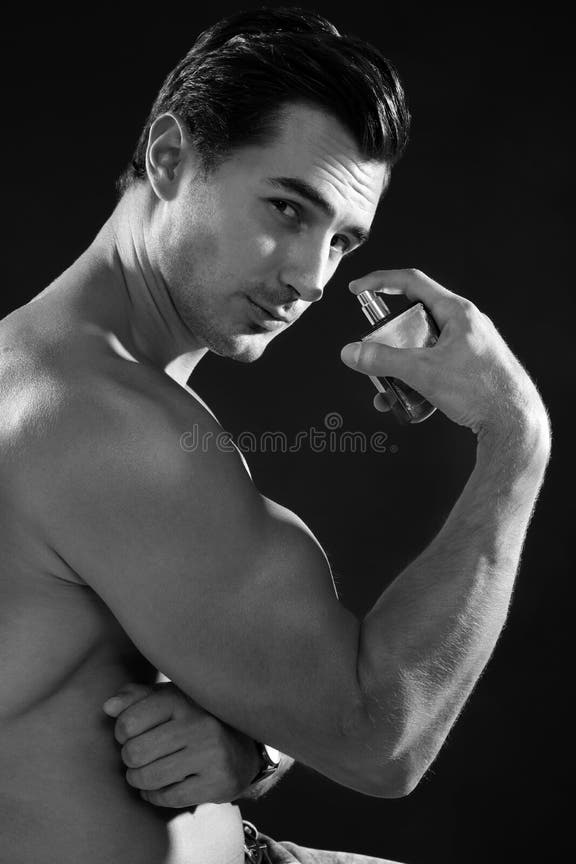 Handsome Young Man Using Perfume Stock Photo - Image of hygiene, effect ...