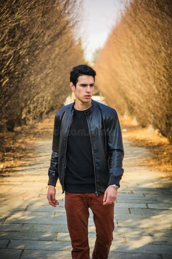 Handsome Young Man Walking Along Rural Road Stock Image - Image of ...