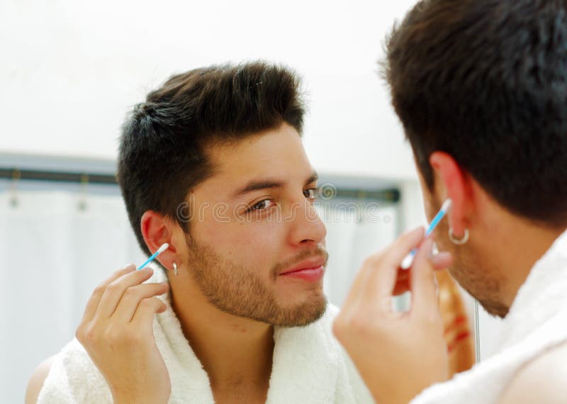 Handsome Young Man Wearing Black Singlet Top Looking in Mirror, Using Q ...