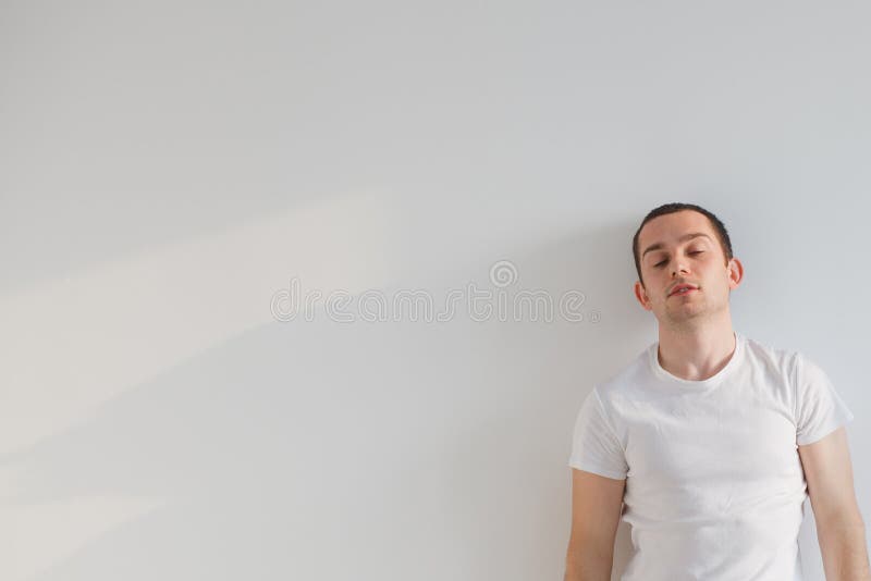 Handsome Young Man at White Wall Stock Photo - Image of copyspace ...