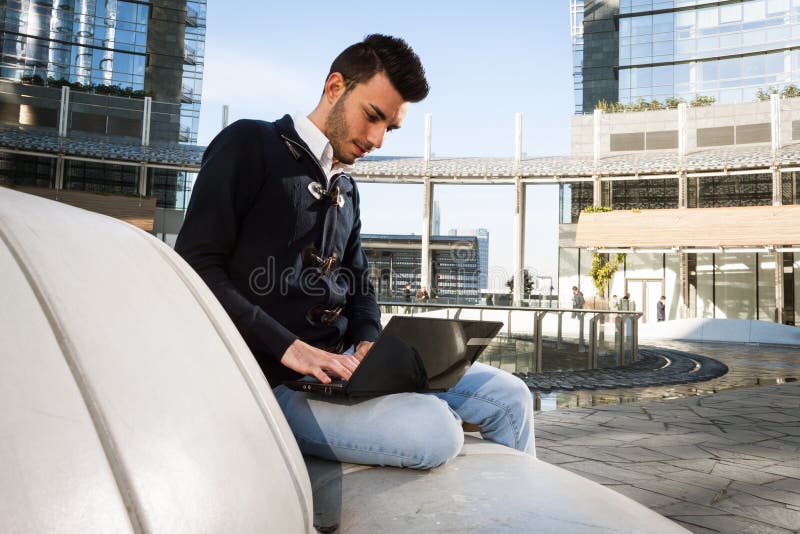 Handsome Young Man Working at Computer Stock Photo - Image of notebook ...