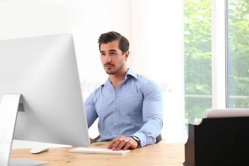 Handsome Young Man Working with Computer at Table Stock Image - Image ...