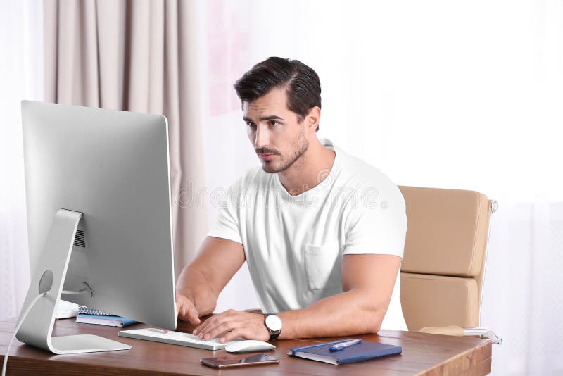 Handsome Young Man Working with Computer at Table Stock Image - Image ...