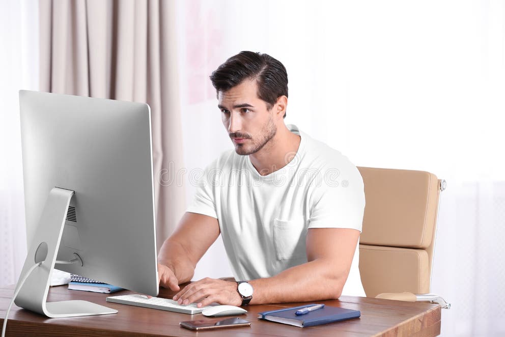 Handsome Young Man Working with Computer at Table Stock Image - Image ...