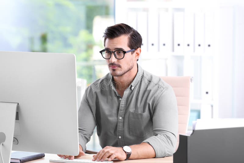 Handsome Young Man Working with Computer at Table Stock Photo - Image ...