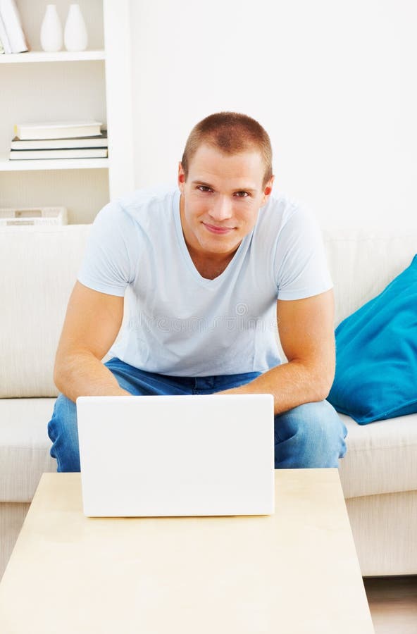 Handsome Young Man Working on a Laptop Stock Image - Image of adult ...