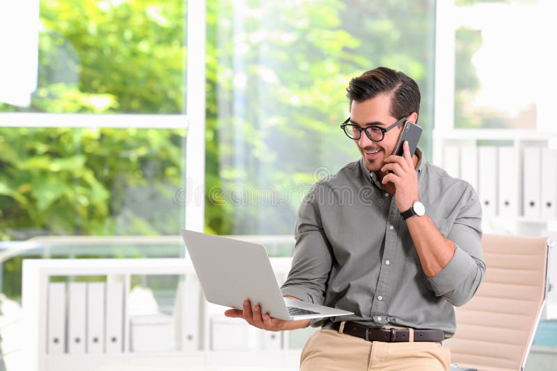 Handsome Young Man Working with Laptop Stock Image - Image of indoors ... Handsome Young Man Working with Laptop Stock Image - Image of indoors ...