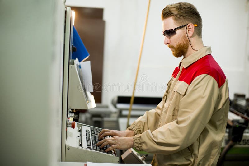 Young Man Working in the Factory Stock Image - Image of manual ...