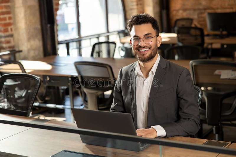 Handsome Young Manager Working in the Office and Looking Confident ...