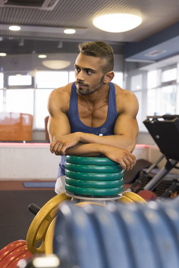 Young Man Having Rest after Training in a Gym Stock Photo - Image of ...
