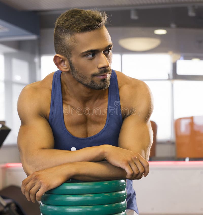 Young Man Having Rest after Training in a Gym Stock Photo - Image of ...