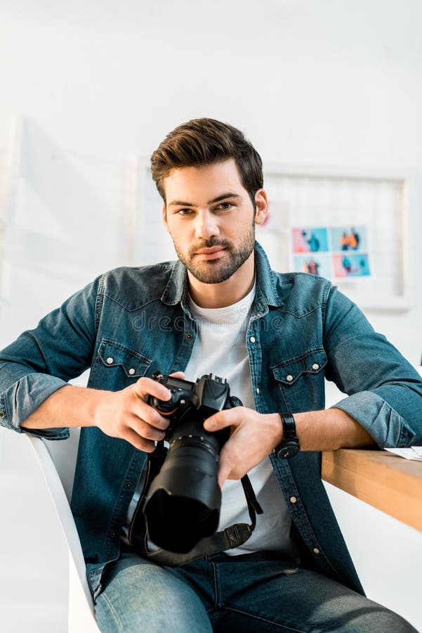 Handsome Young Photographer Holding Photo Camera Stock Image - Image of ...