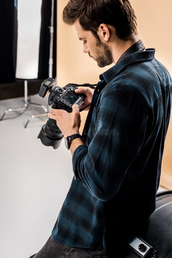Handsome Young Photographer Using Camera Stock Image - Image of ...