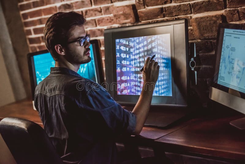 Handsome young programmer stock image. Image of gadget - 103908233